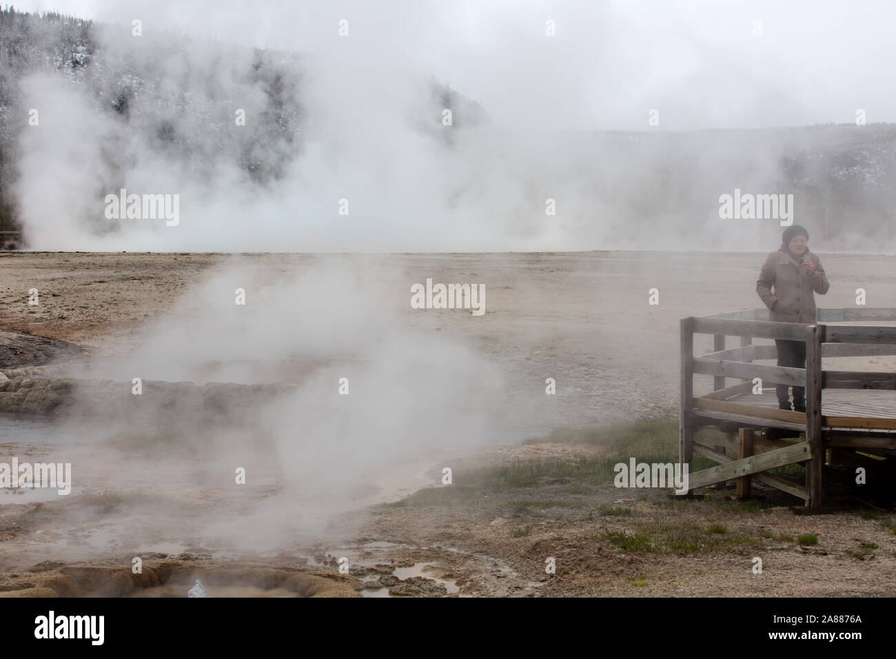 YELLOWSTONE - A woman smoking a cigarette in the fog near the grand ...