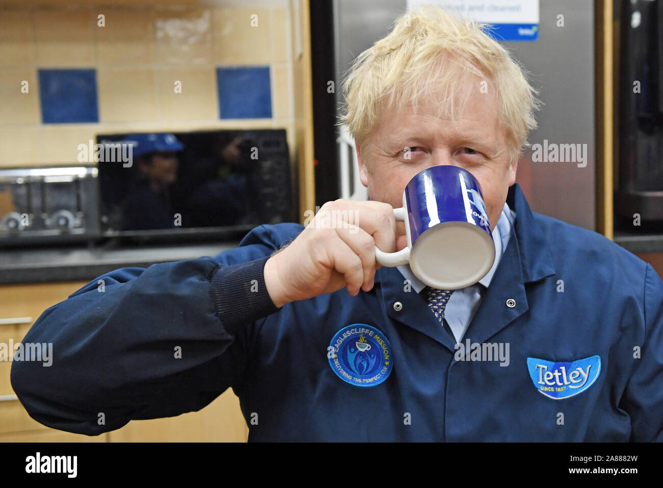Prime Minister Boris Johnson drinks a cup of tea during a visit to the ...