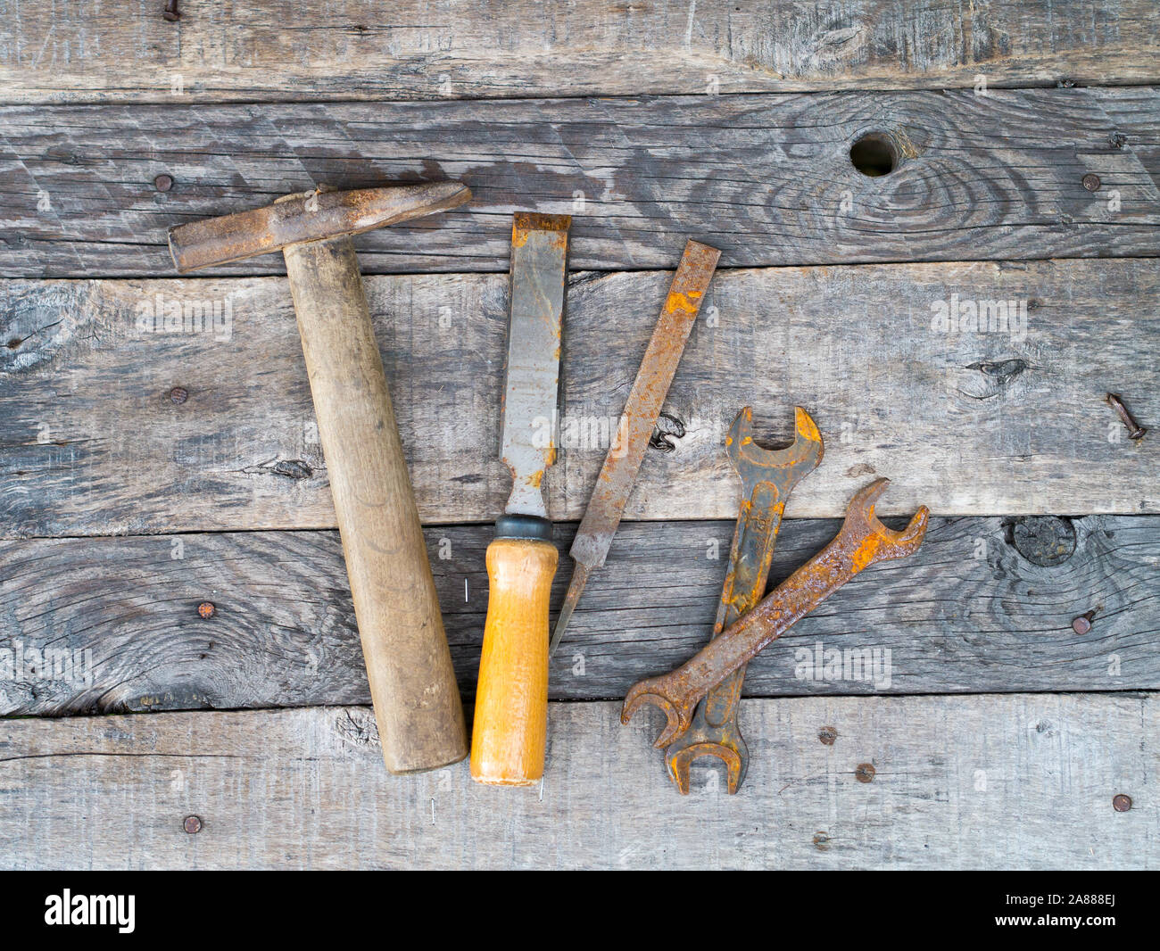 Old rusty vintage tools on weathered grey background Stock Photo - Alamy