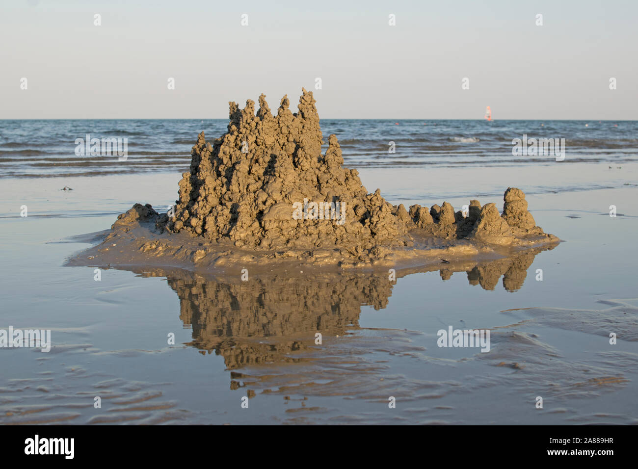 Sand castle on the water made from drops of a liquid mixture of water ...