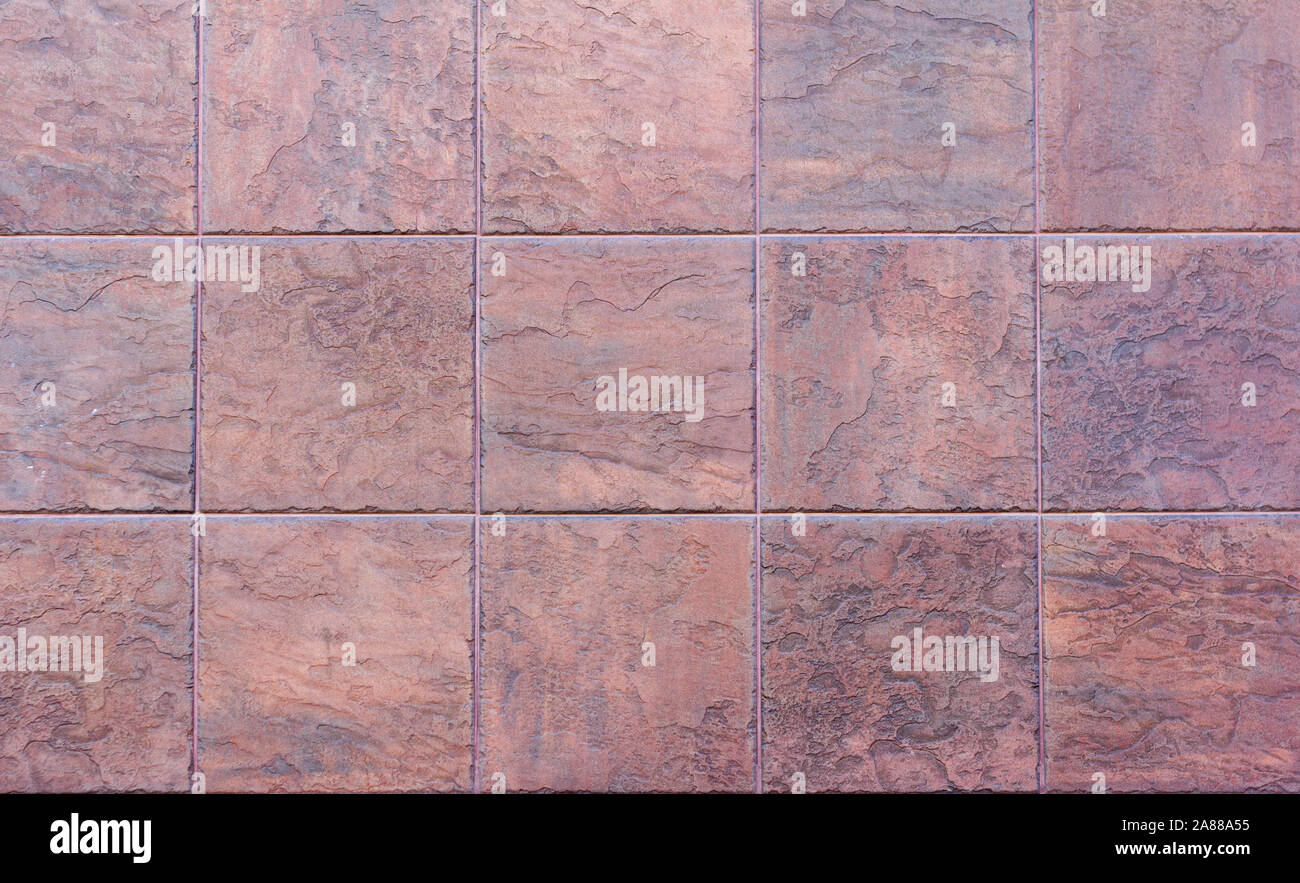 Decorative tiles of brown stone, background.The texture of the stone ...