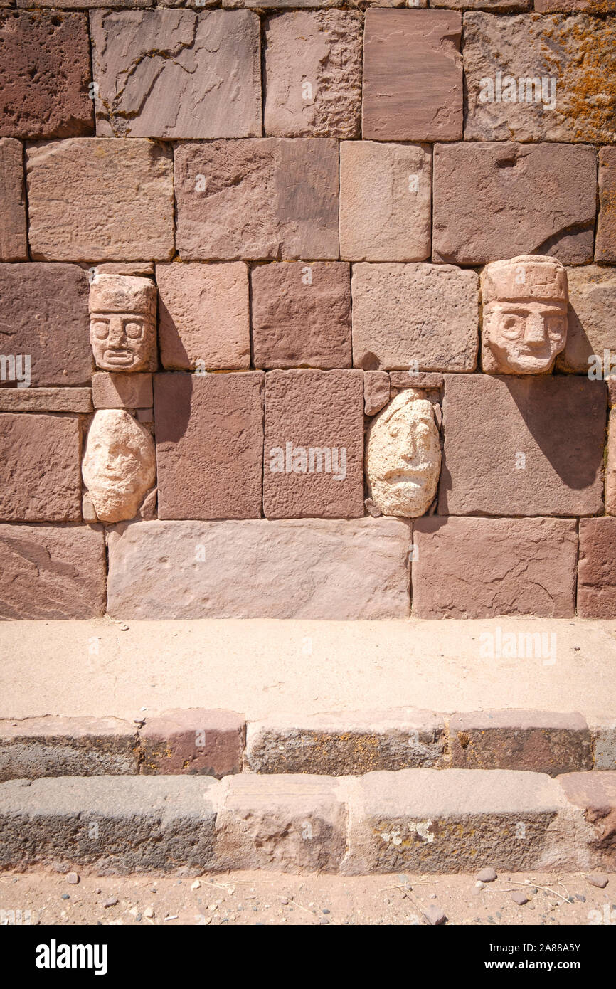 Carved stone tenon heads on the walls of the Semi-underground Temple in ...