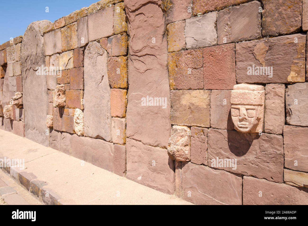 Carved stone tenon heads on the walls of the Semi-underground Temple in ...