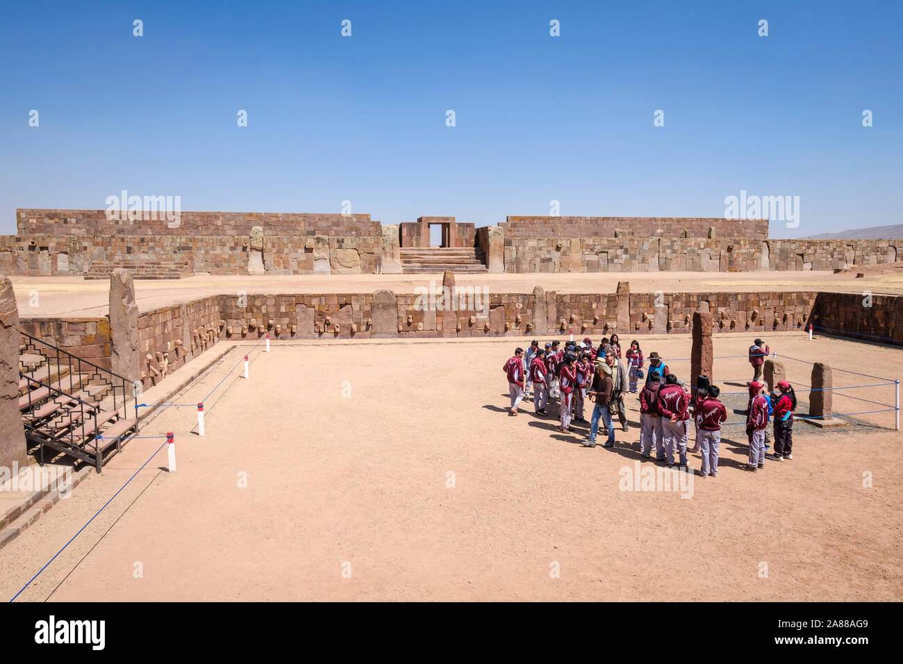 Bolivian students in school uniform at Semi-underground Temple entrance ...