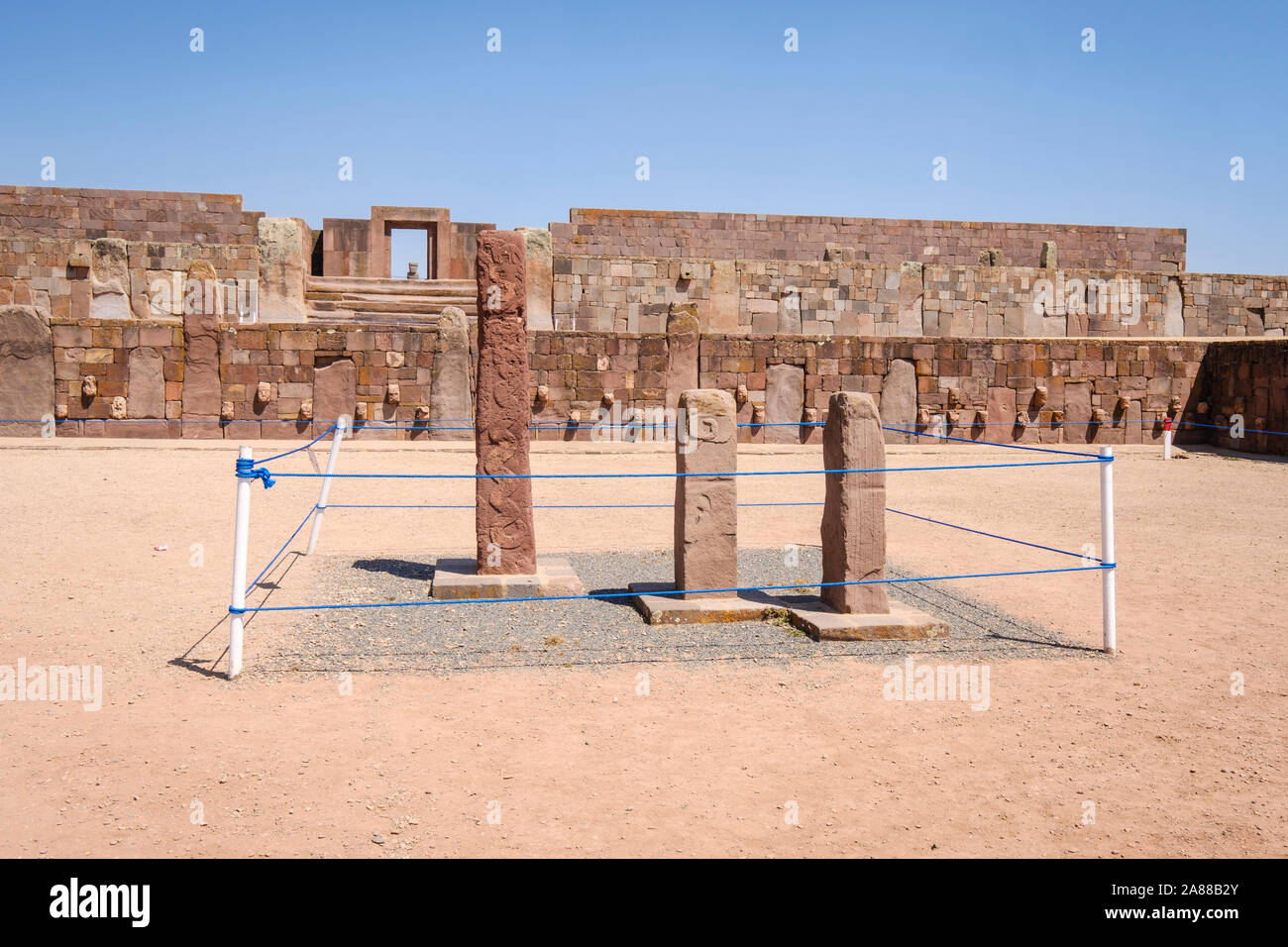 Semi-underground Temple monoliths with the Kalasasaya Temple wall in ...