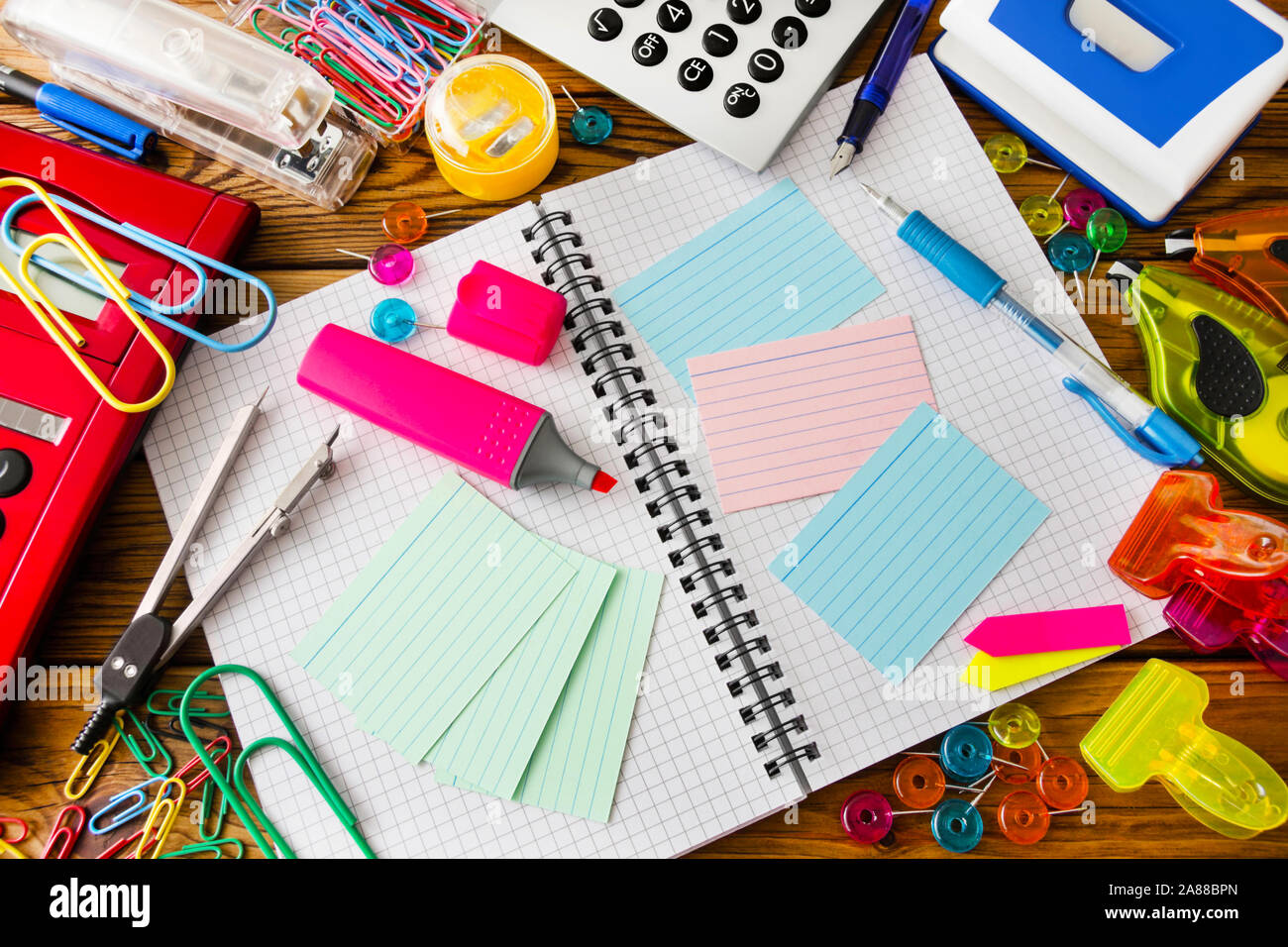 Desk and colorful stationery Stock Photo - Alamy