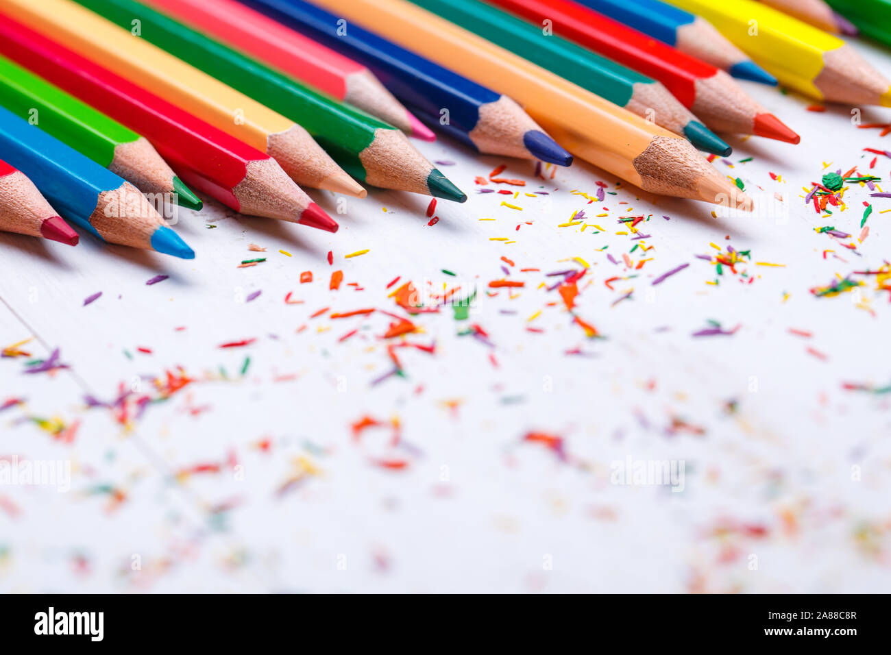 Bright color palette of crayons on the table Stock Photo - Alamy