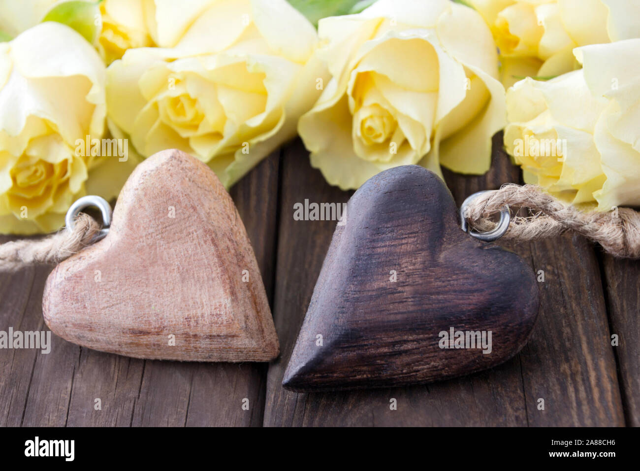 Roses and two hearts Stock Photo - Alamy