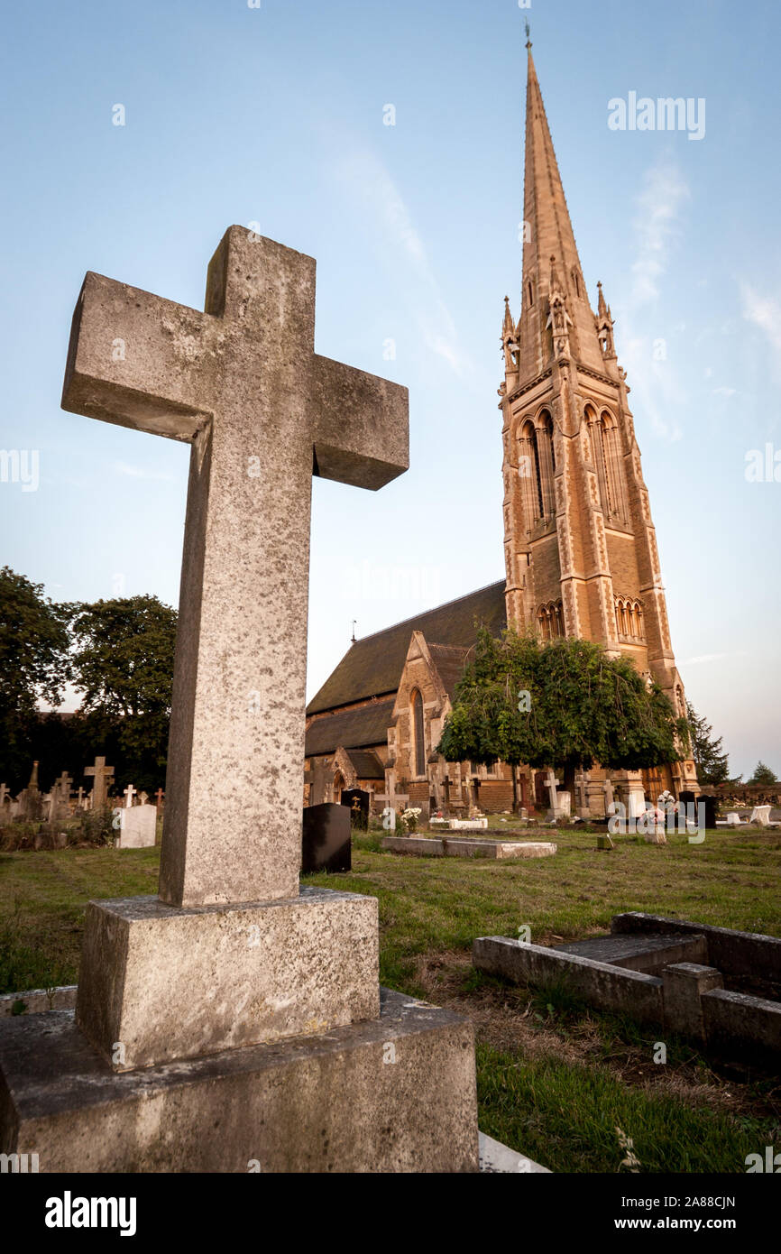Traditional English spired church in a dusky rural location with a ...