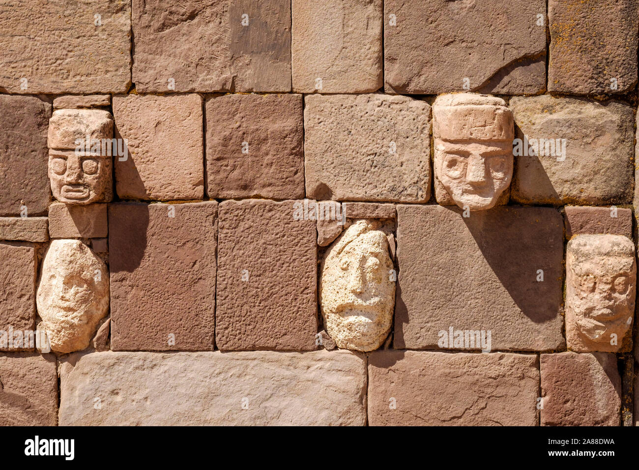 Carved stone tenon heads on the walls of the Semi-underground Temple in ...