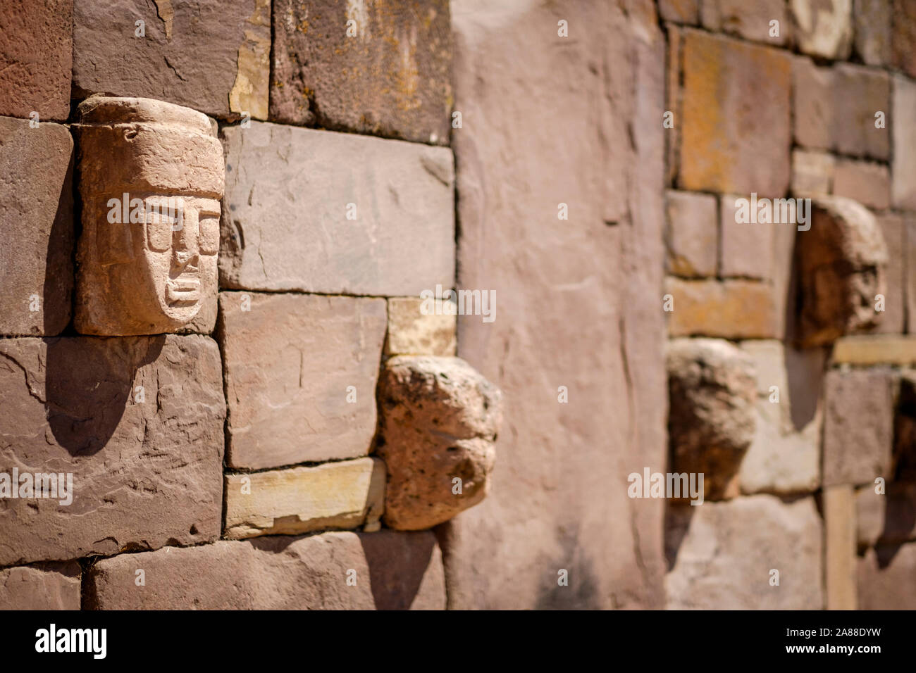Carved stone tenon heads on the walls of the Semi-underground Temple in ...