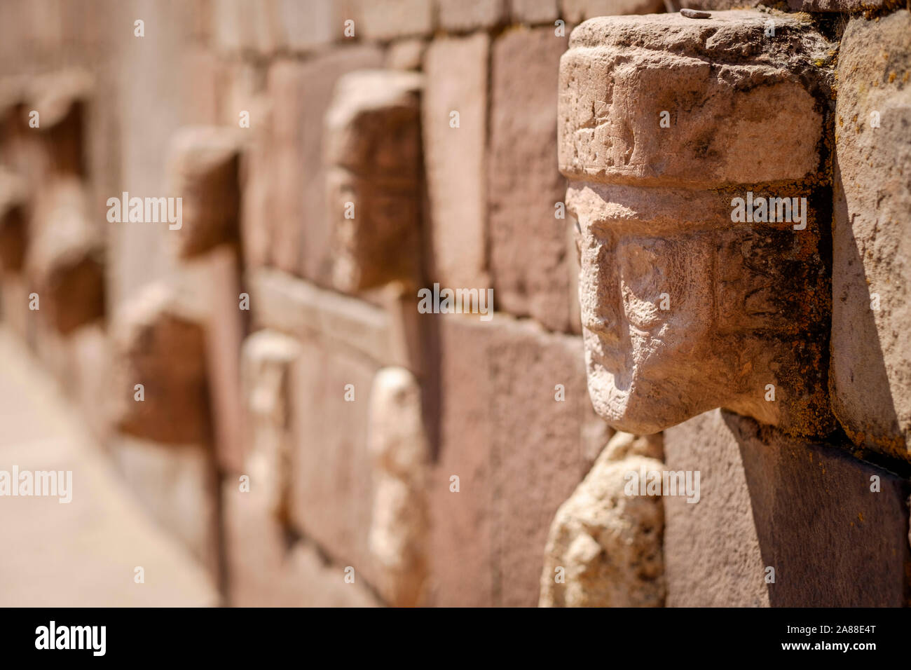 Carved stone tenon heads on the walls of the Semi-underground Temple in ...