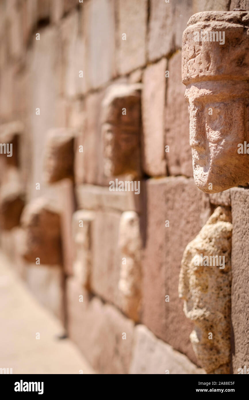 Carved stone tenon heads on the walls of the Semi-underground Temple in ...
