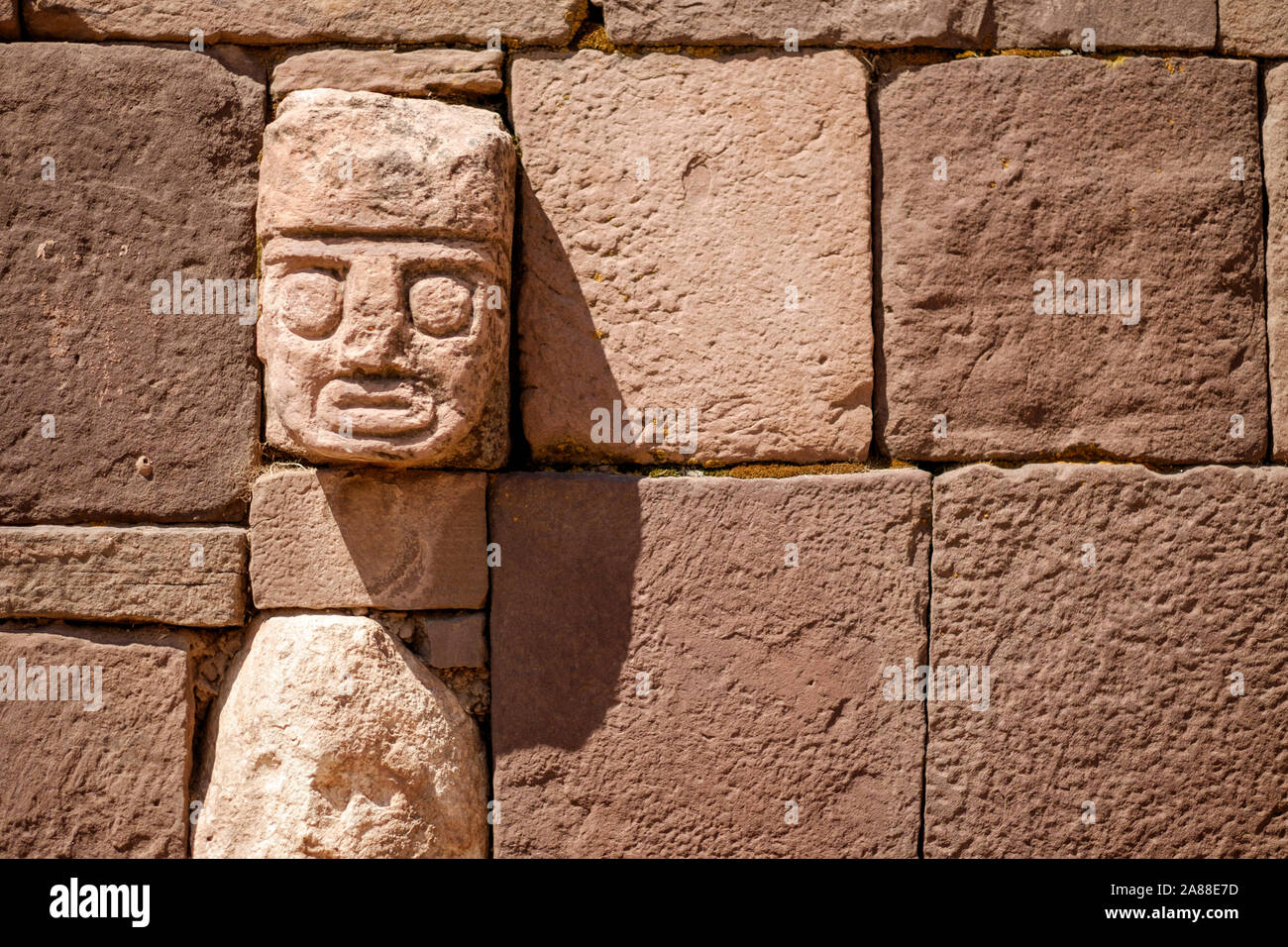 Carved stone tenon heads on the walls of the Semi-underground Temple in ...