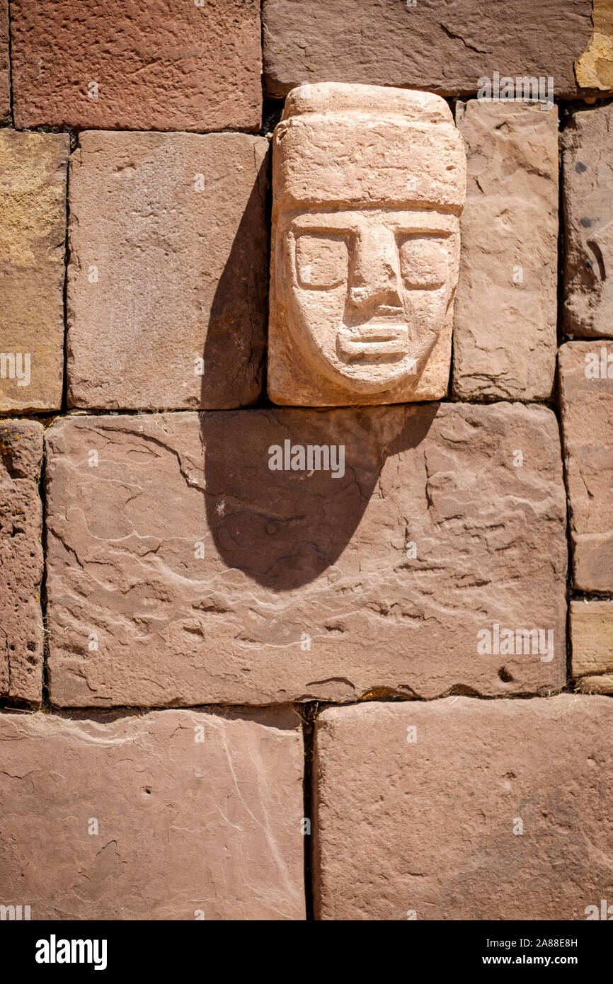 Carved stone tenon head on the walls of the Semi-underground Temple in ...