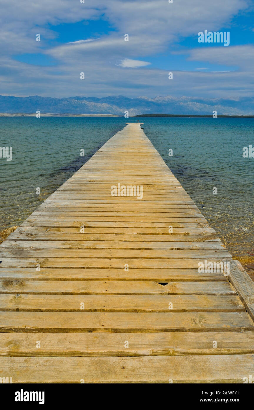Wooden sea dock spreaded into the sea Stock Photo - Alamy