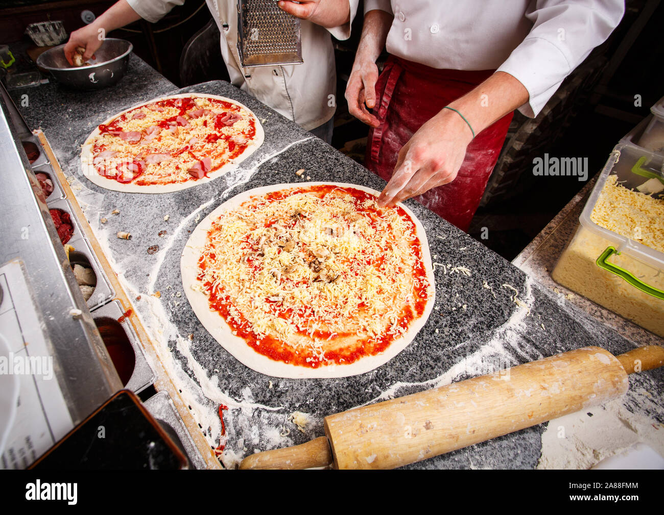 Two pizzas table hi-res stock photography and images - Alamy