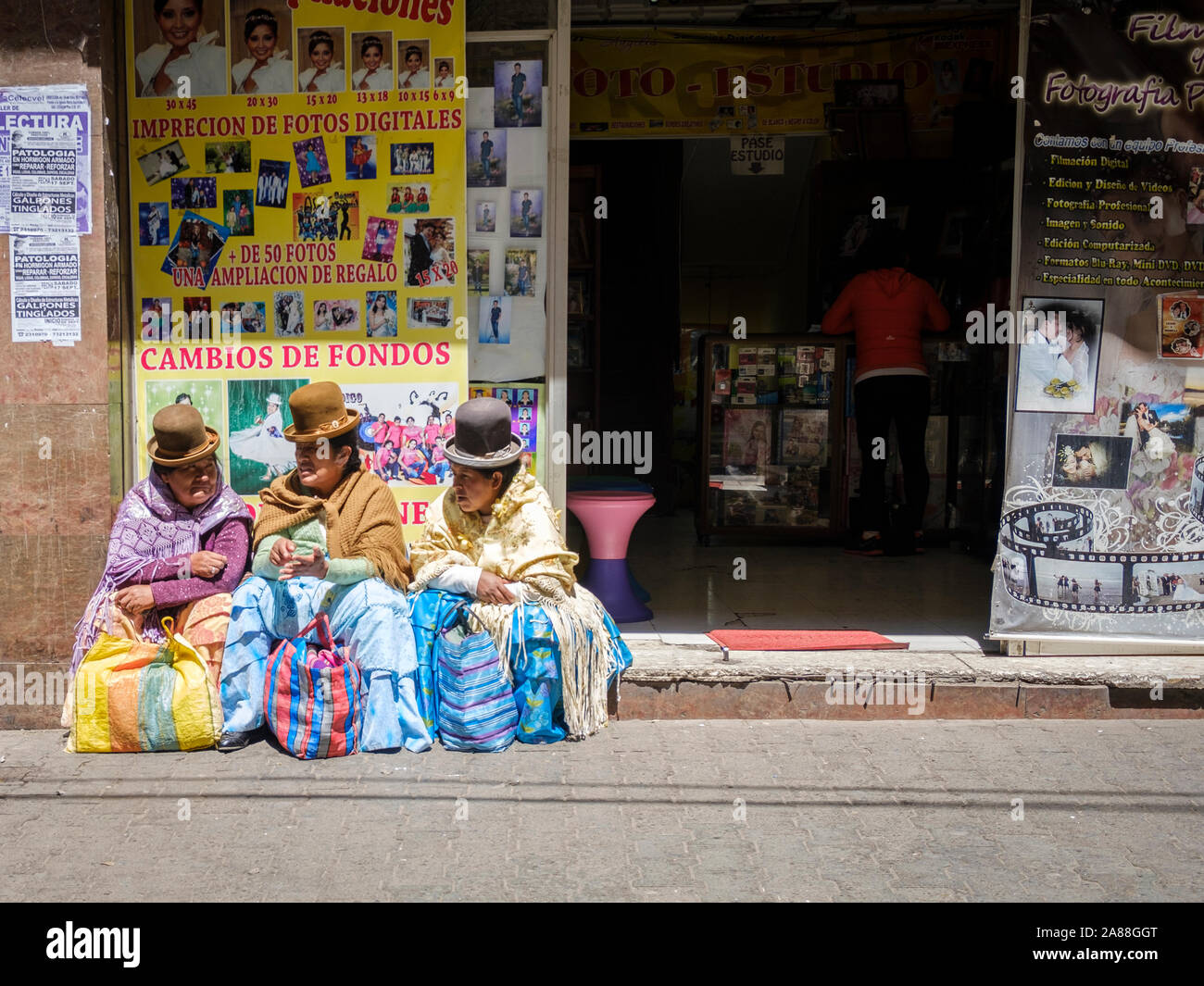 Sitting women wearing the traditional bowler hat in the Historic ...