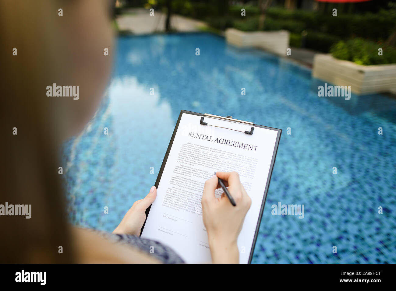 close up portrait of signing rental agreement on background of s Stock ...