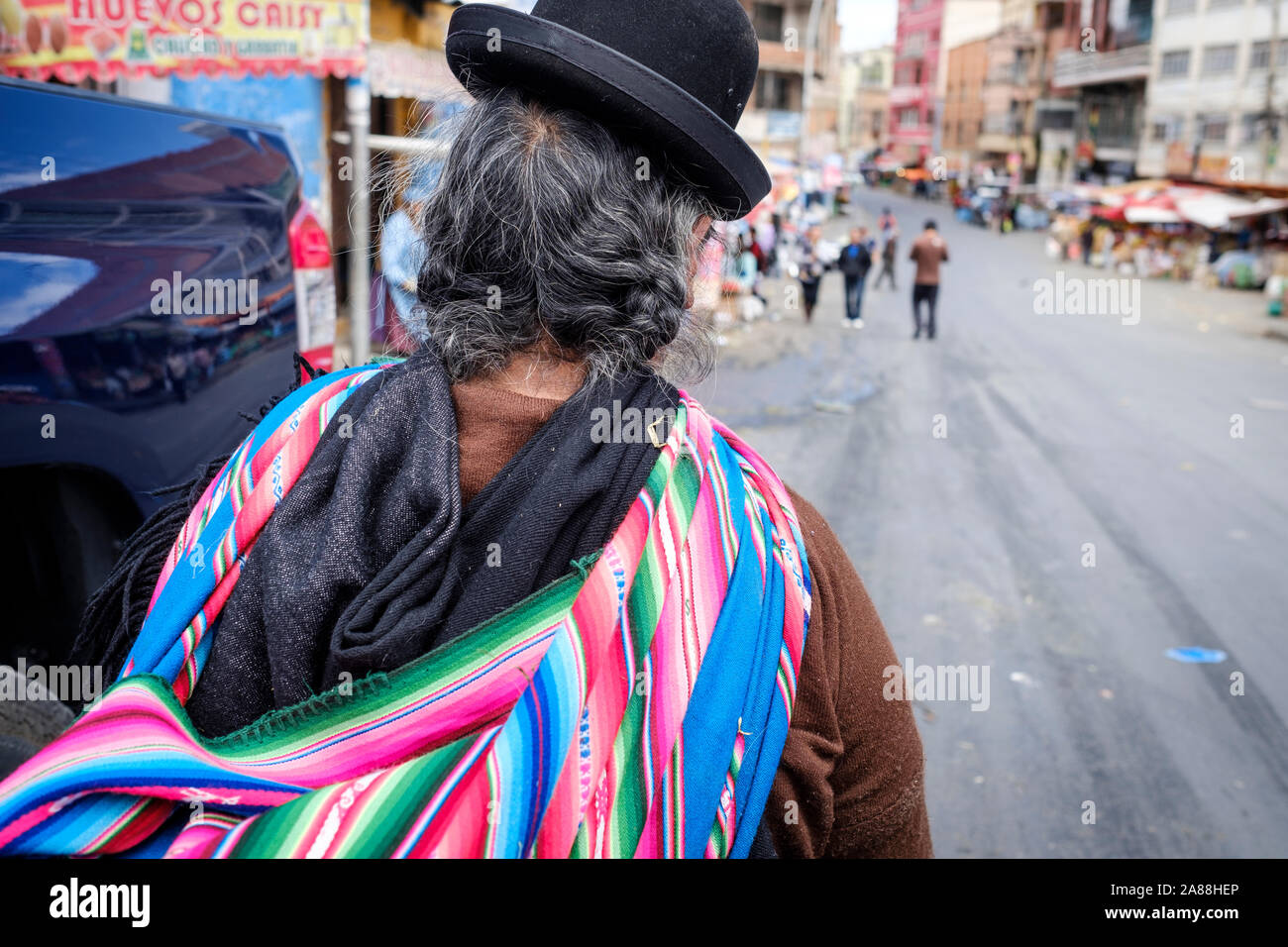 Local woman wearing the classic Bolivian bowler hat on the streets of ...