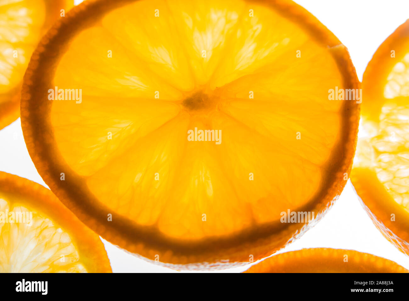 Orange slices back lighting Stock Photo - Alamy
