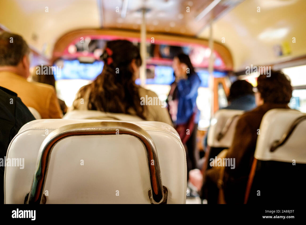 Inside a public bus in La Paz, Bolivia. Selective focus with a blurred ...