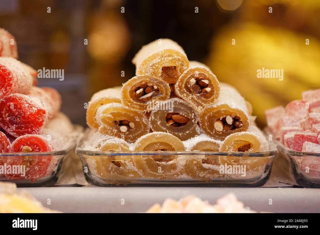 Yellow Rolled Turkish Delight with almond pieces in it. This wrapped ...