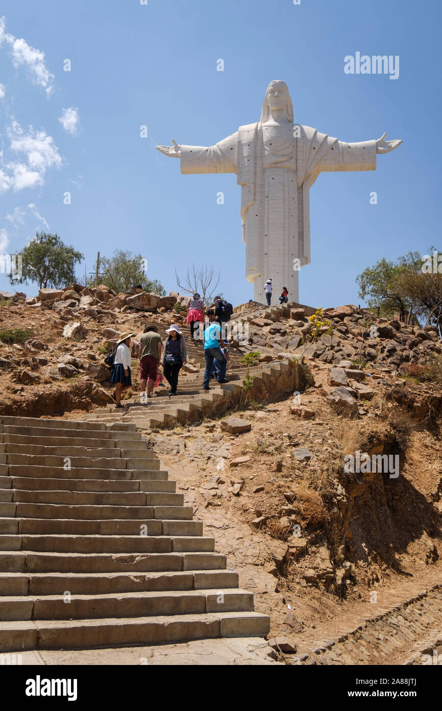 Local people walking up to the Cristo de la Concordia (or Christ the ...
