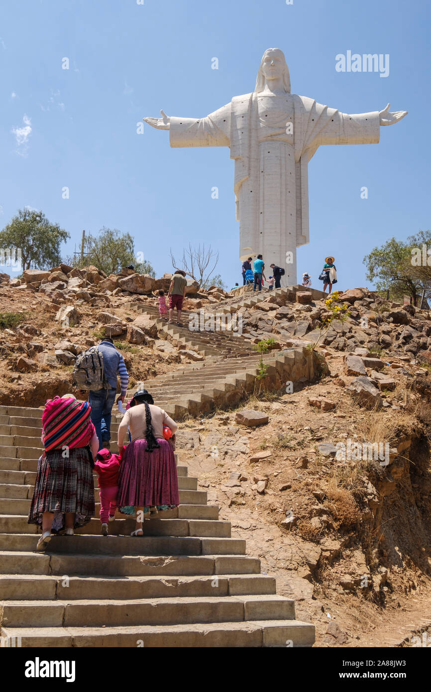 Local people walking up to the Cristo de la Concordia (or Christ the ...