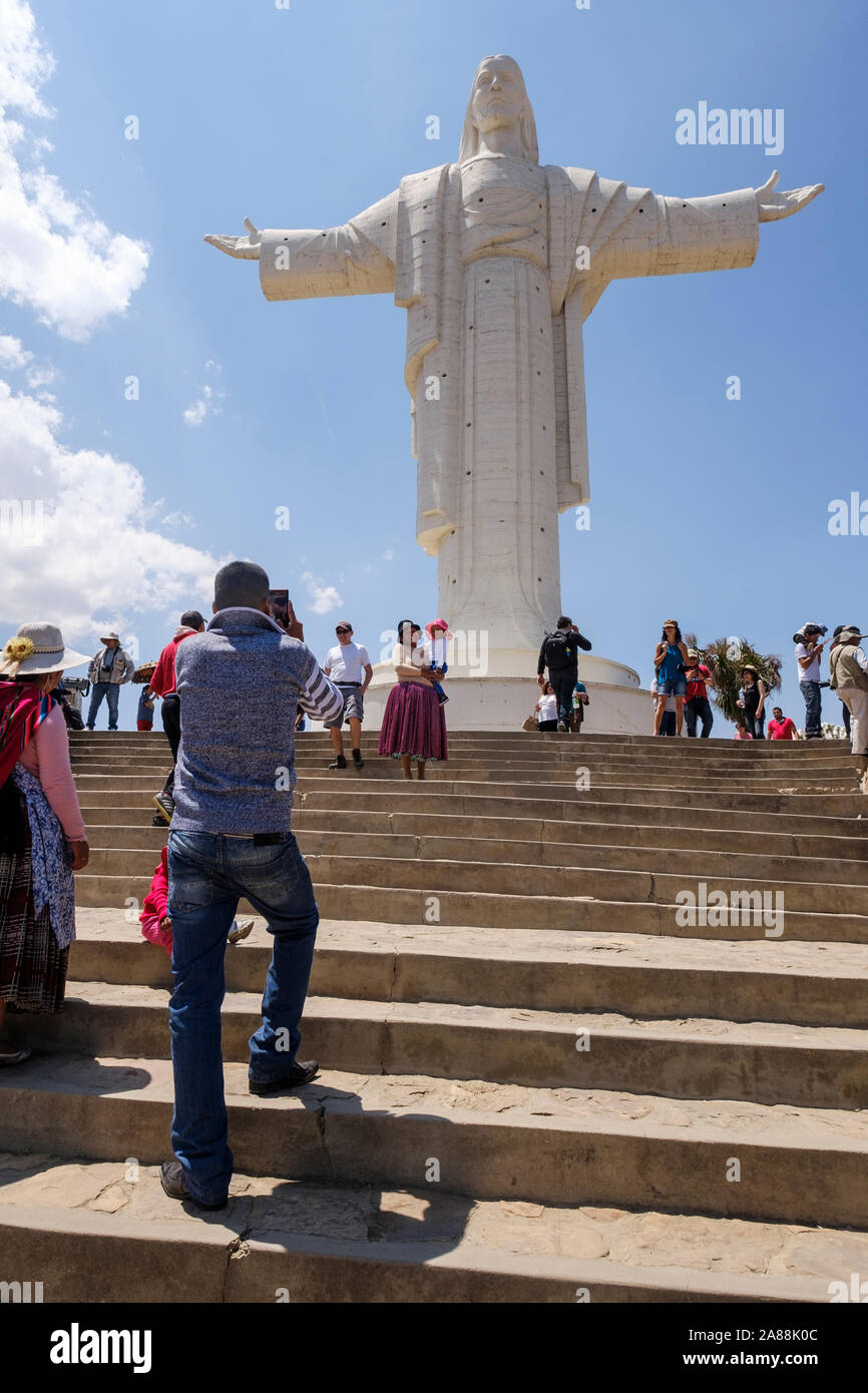 Local people taking photographs at Cristo de la Concordia (or Christ ...