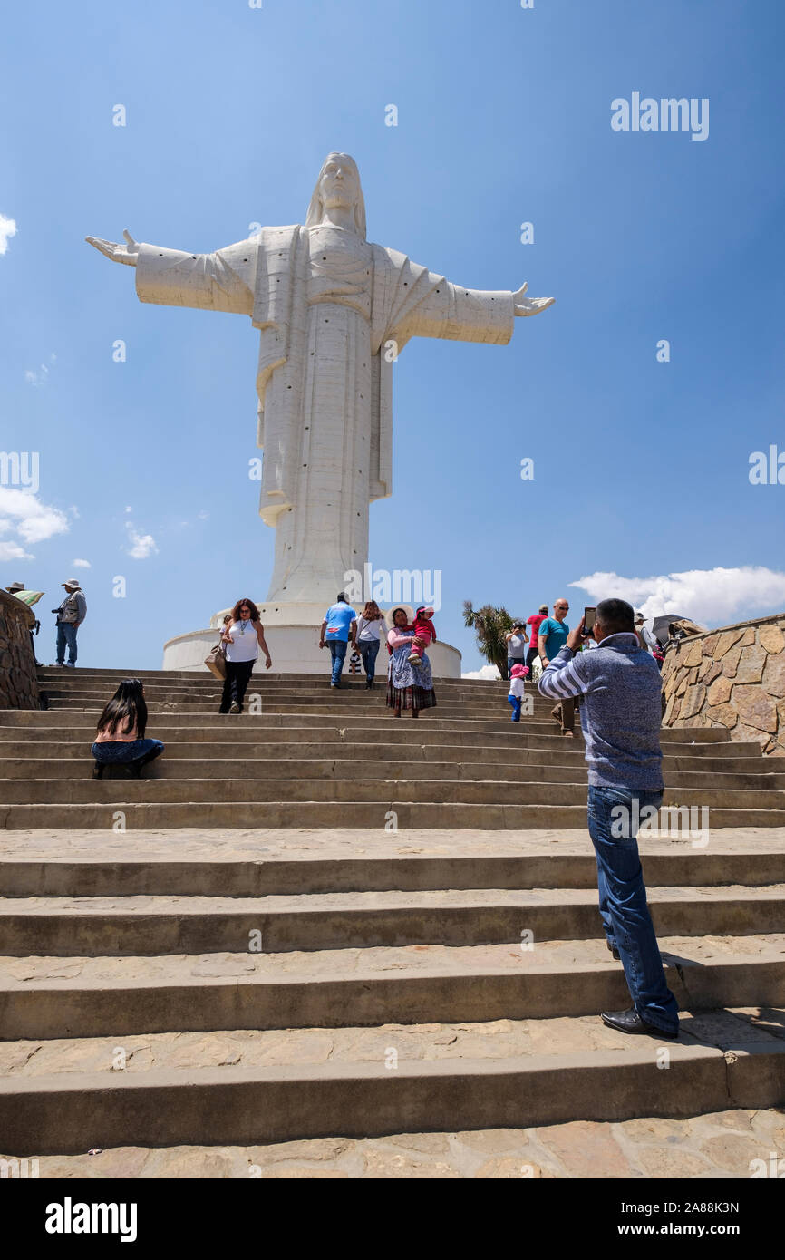 Local people taking photographs at Cristo de la Concordia (or Christ ...