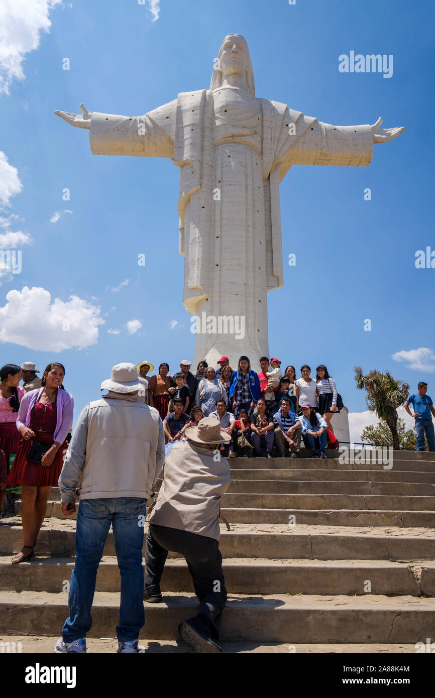 Local people taking photographs at Cristo de la Concordia (or Christ ...