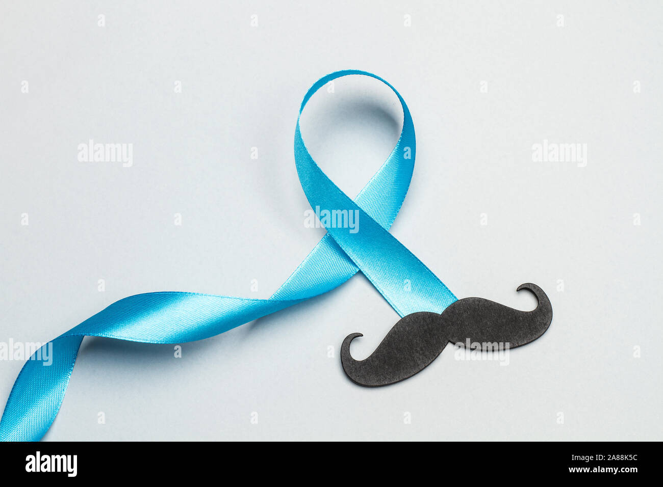 A blue ribbon and a black moustache on a gray blackground Stock Photo ...