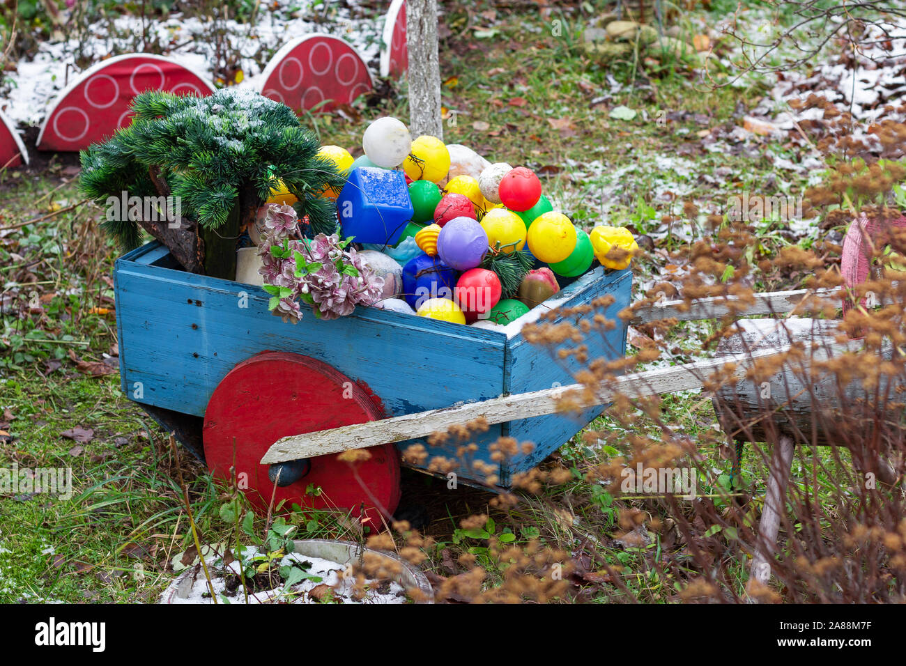 trolley with toys in the winter garden. decoration of back yard Stock ...