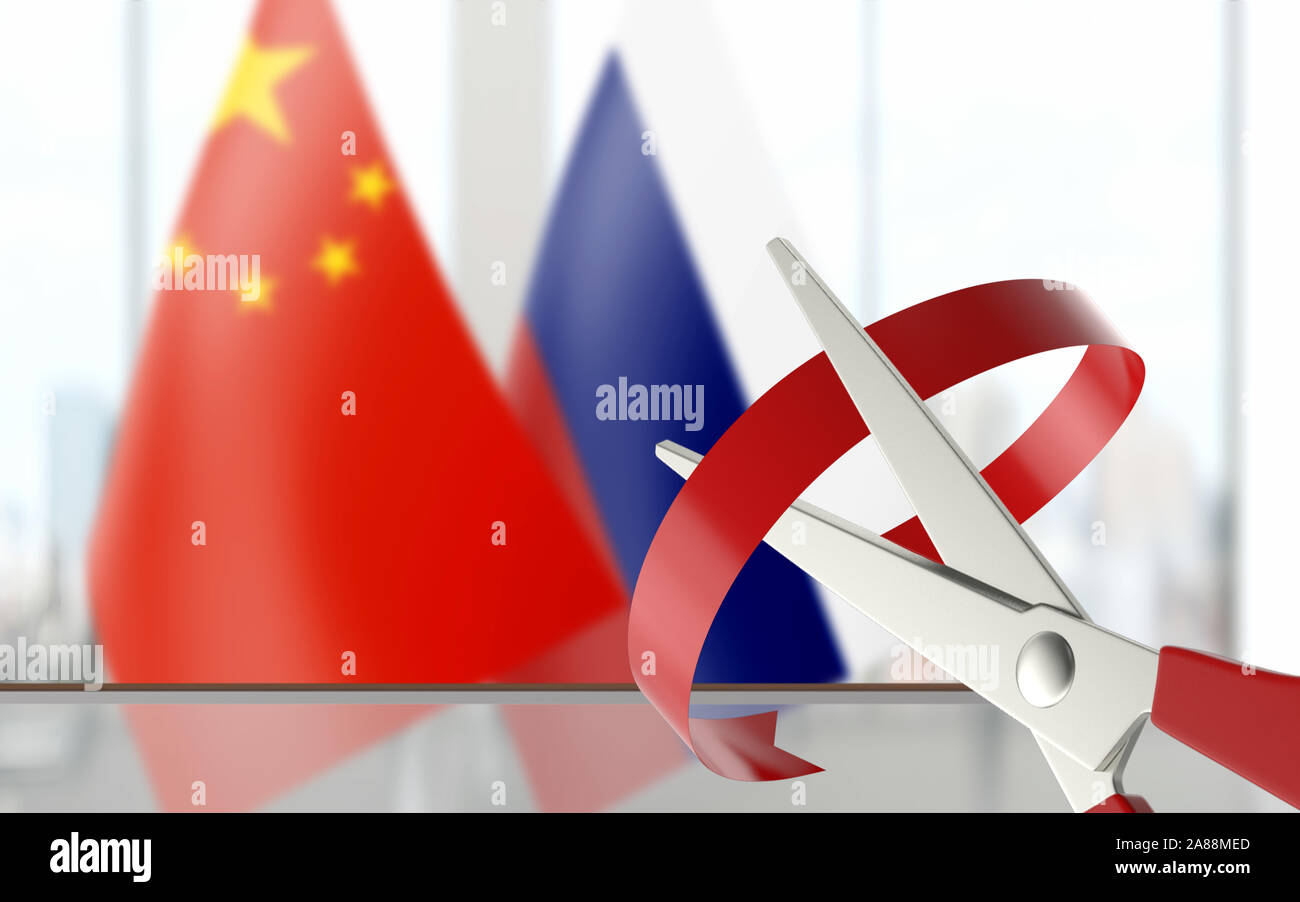 Flags are paired together at an office background while scissor is ...