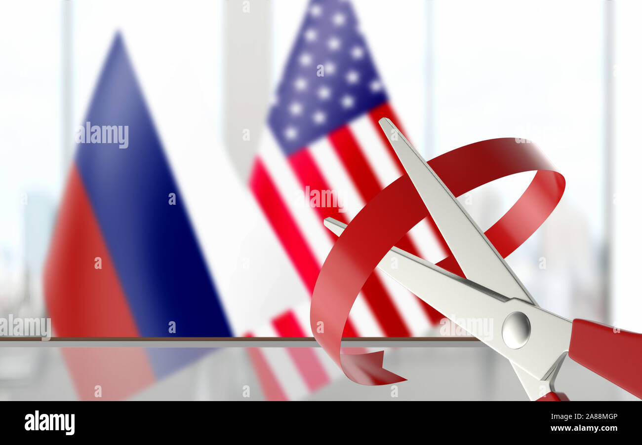 Flags are paired together at an office background while scissor is ...