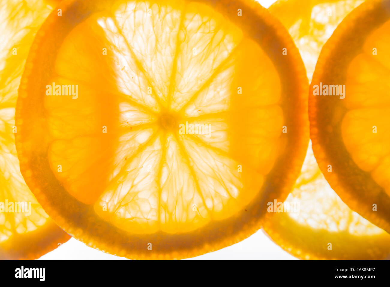 Orange slices back lighting Stock Photo - Alamy