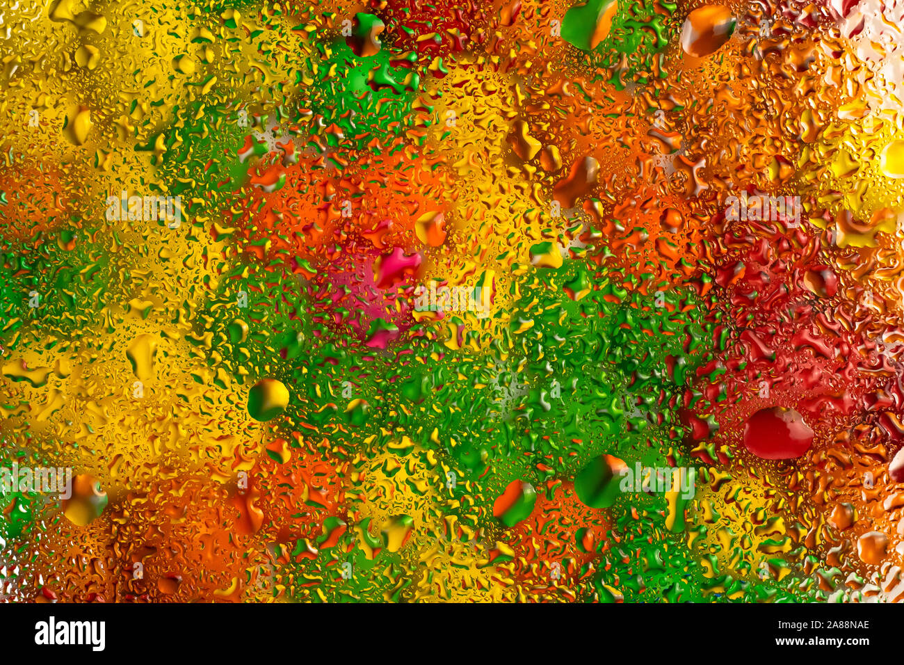 Shiny multicolor creative background with water drops. Abstract ...