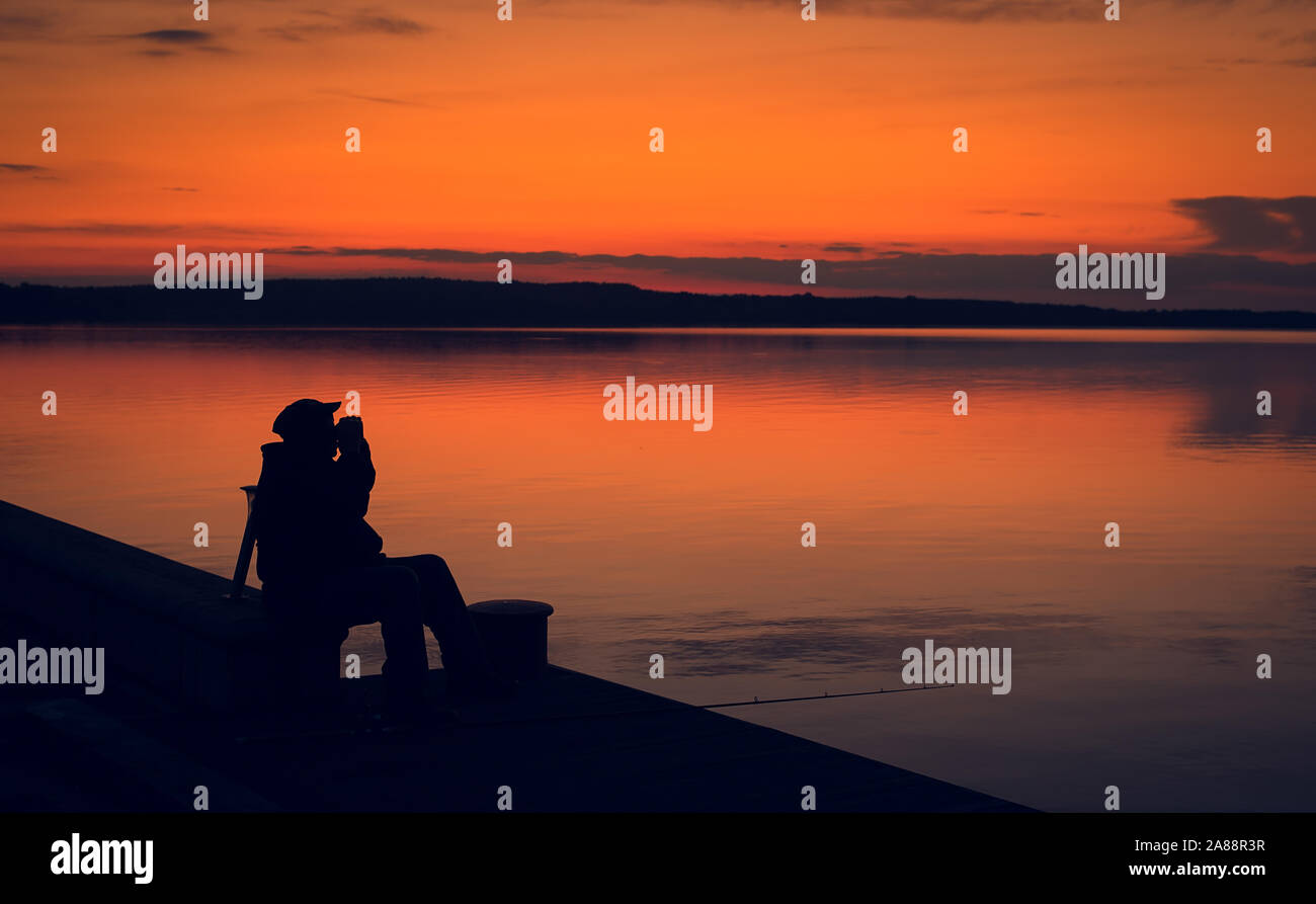 Fisher man fishing in sunset. Silhouette photo of a fisher man Stock ...