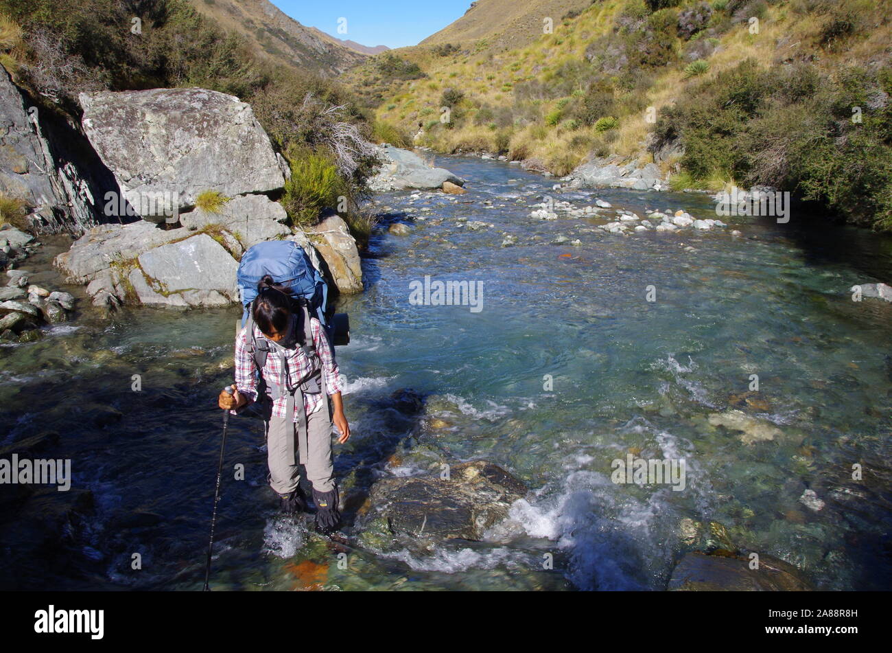 Thai female backpacker Te Araroa Trail. Motatapu Alpine Track. South ...