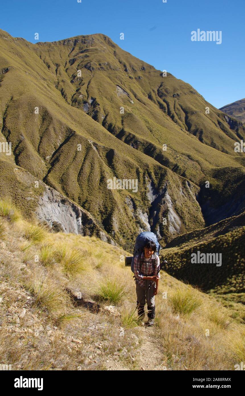 Thai female backpacker Te Araroa Trail. Motatapu Alpine Track. South ...