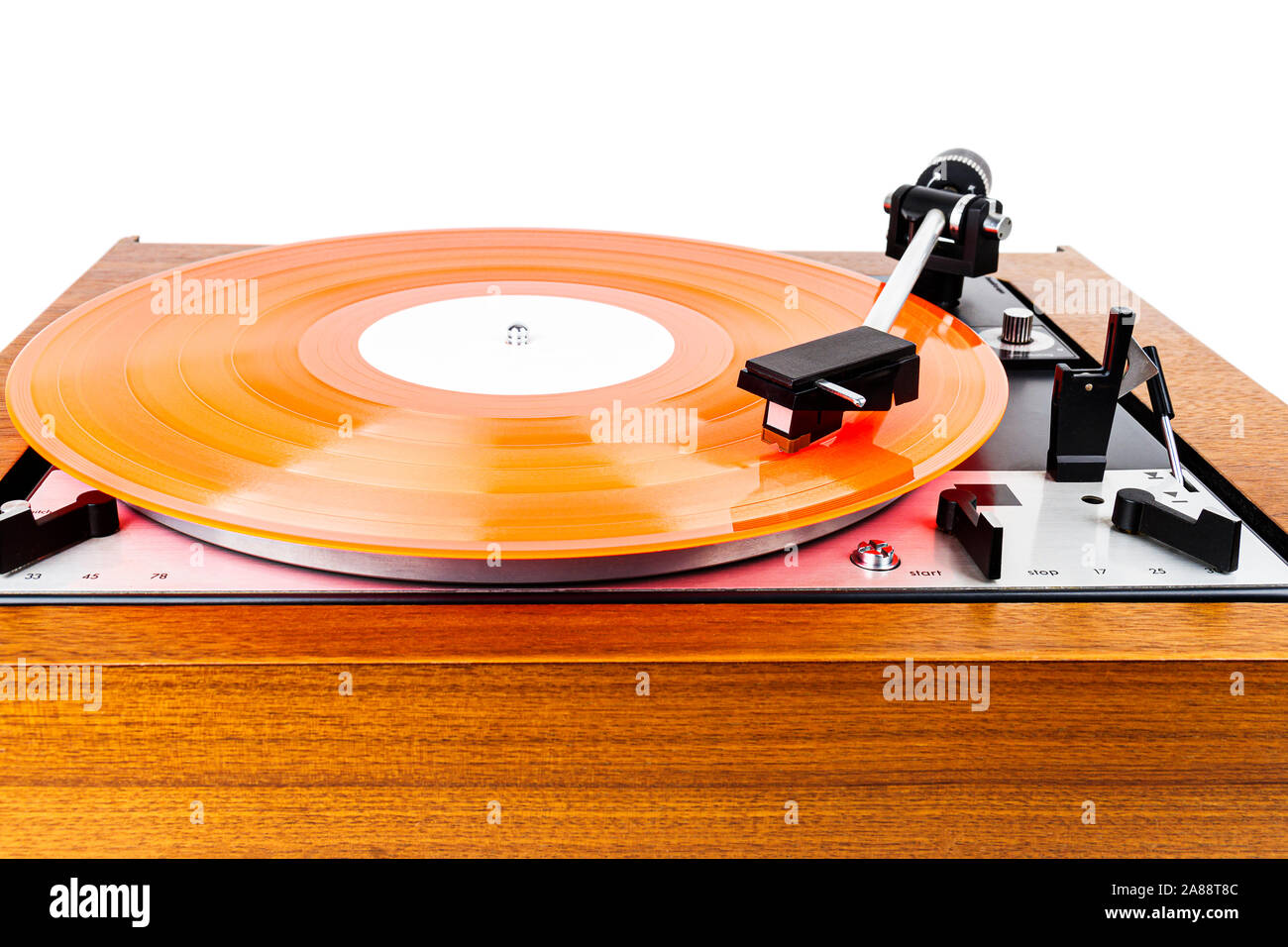 Vintage turntable with a red vinyl isolated on white. Wooden plinth ...
