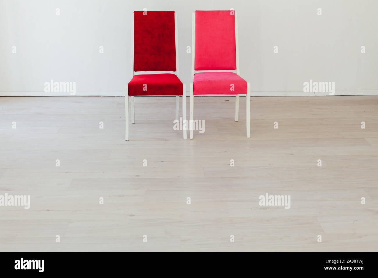 two chairs in the interior of an white room Stock Photo - Alamy