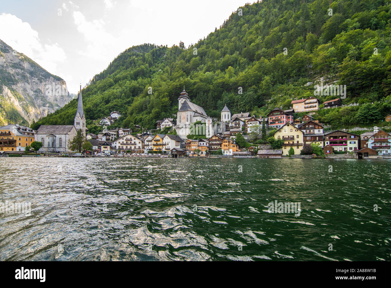HALLSTATT, AUSTRIA - July, 2019: Scenic picture-postcard view of famous ...