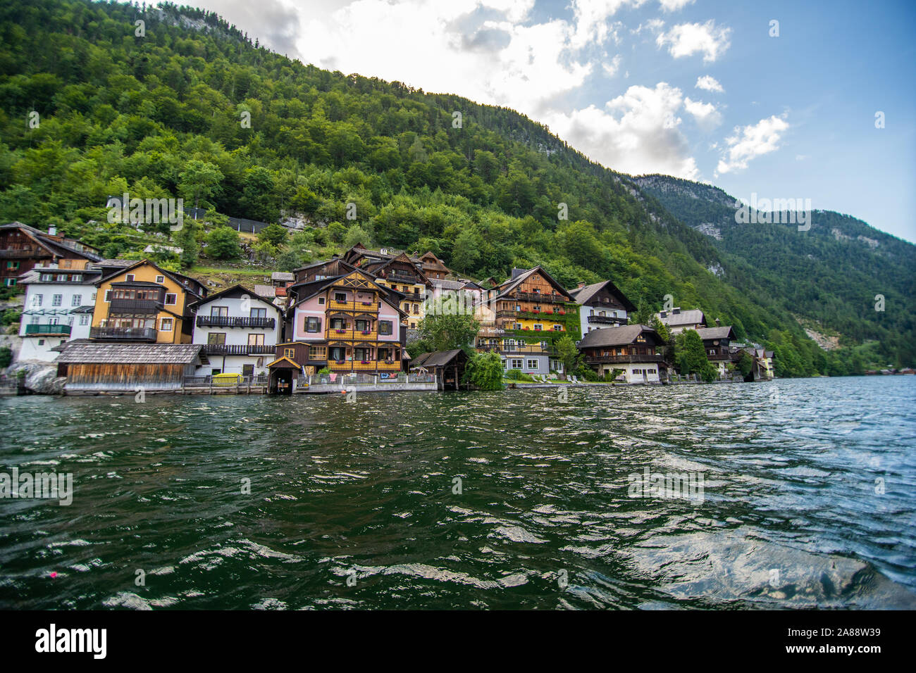 HALLSTATT, AUSTRIA - July, 2019: Scenic picture-postcard view of famous Hallstatt mountain ...
