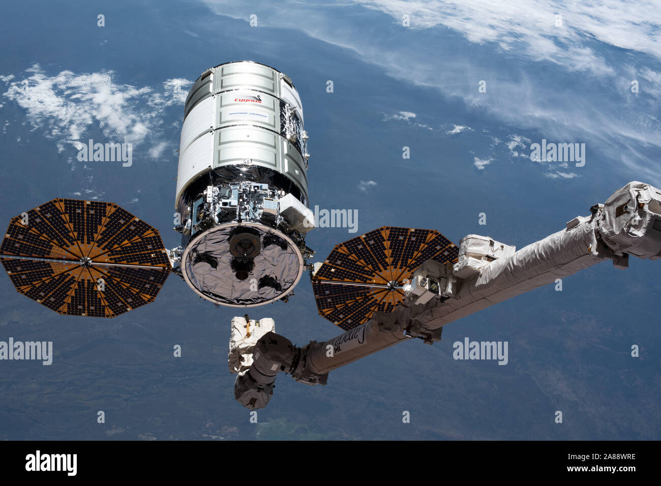 The Northrop Grumman Cygnus space freighter is grappled by the ...