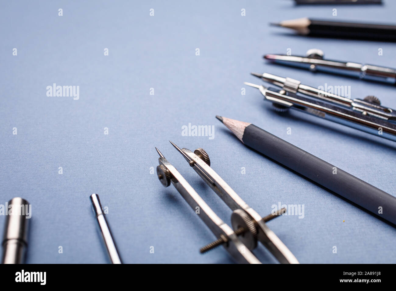 Black compass on blue background hi-res stock photography and images ...