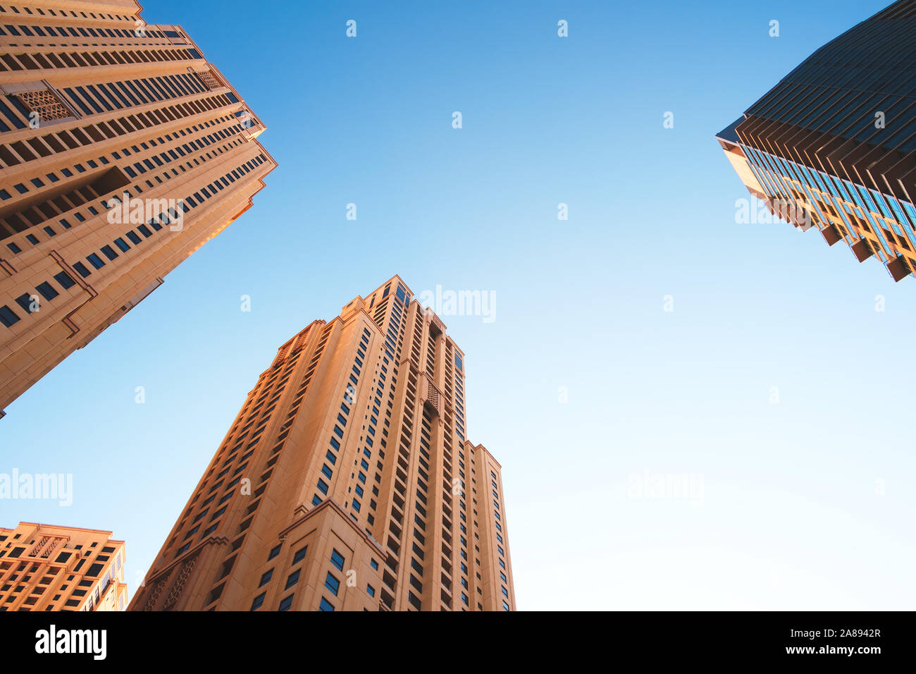 Abstract skyscrapers with sun glare toned in vintage style Stock Photo ...