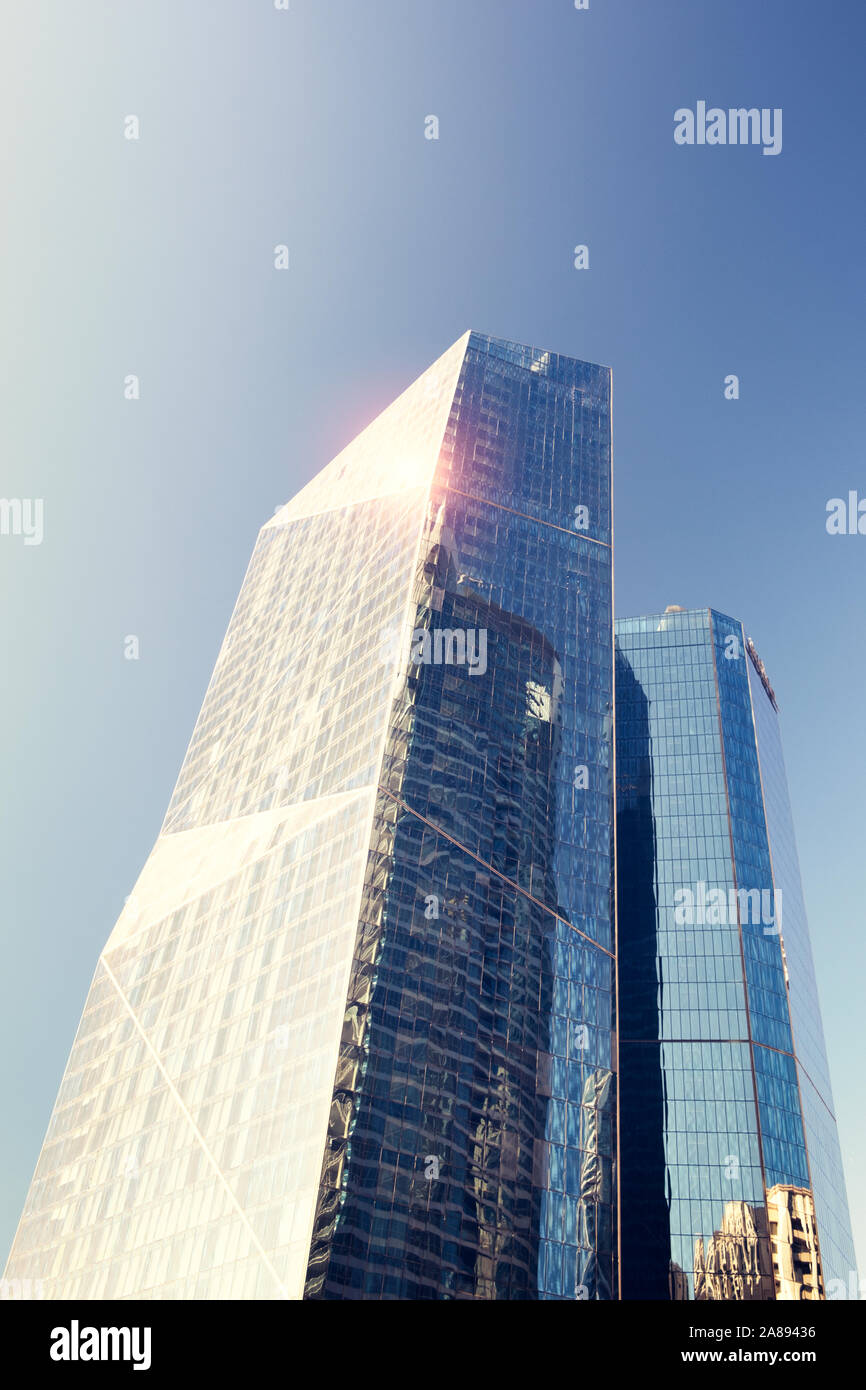 Abstract skyscrapers with sun glare toned in vintage style Stock Photo ...
