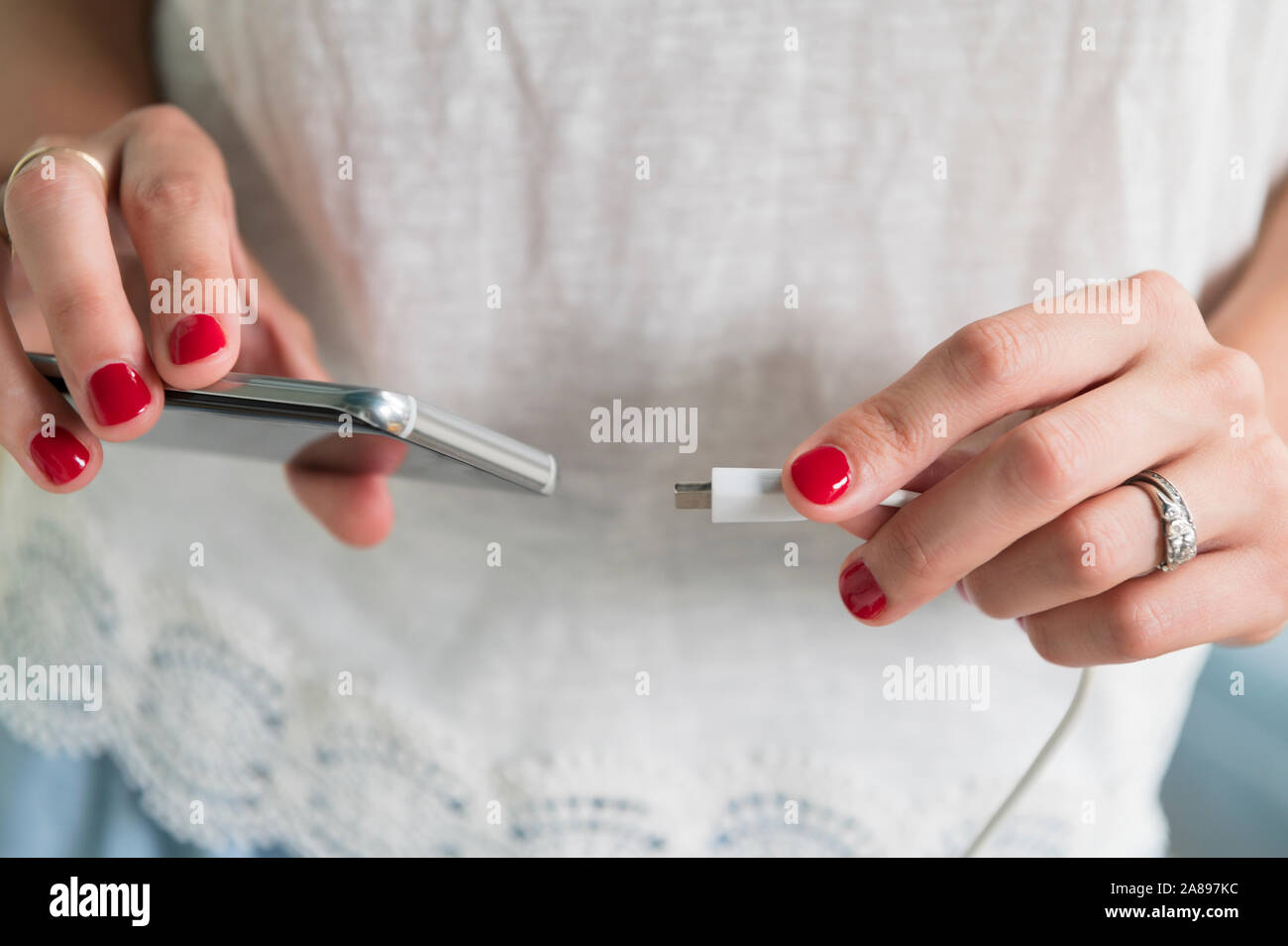 Woman plugging hi-res stock photography and images - Alamy